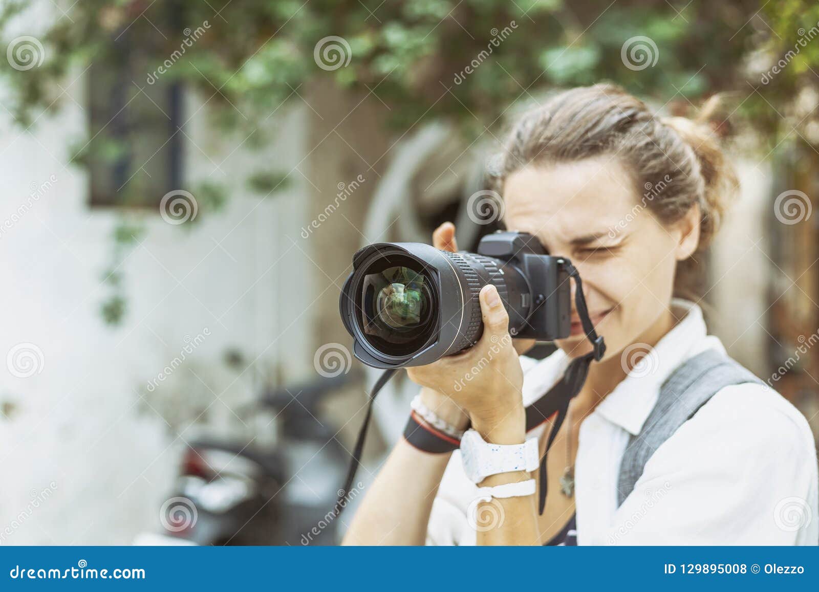 Beautiful Young Woman with a Camera in Her Hands, Professional a Stock ...
