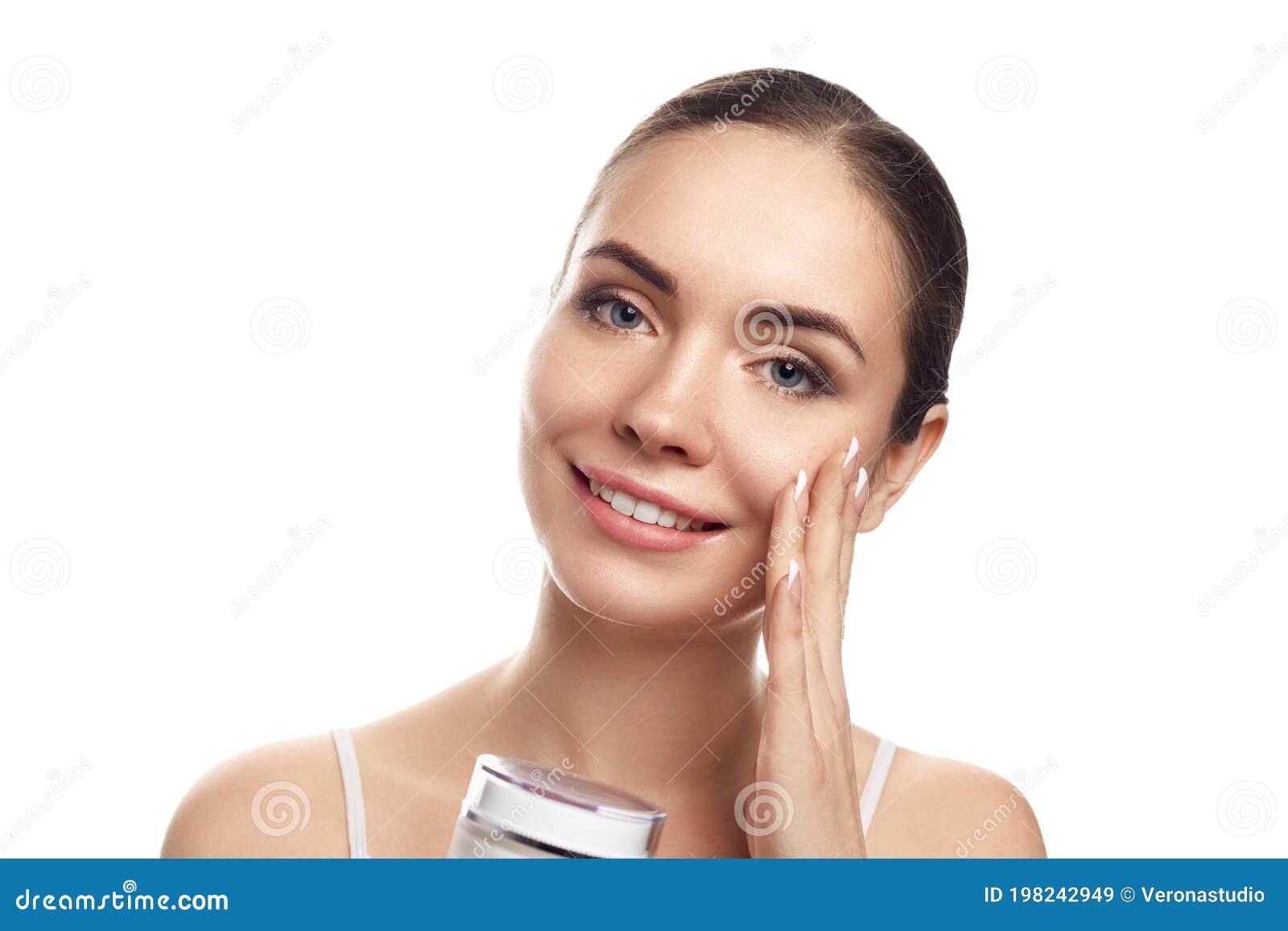 Beautiful Young Woman With Clean Fresh Skin Touch Own Face And Holds
