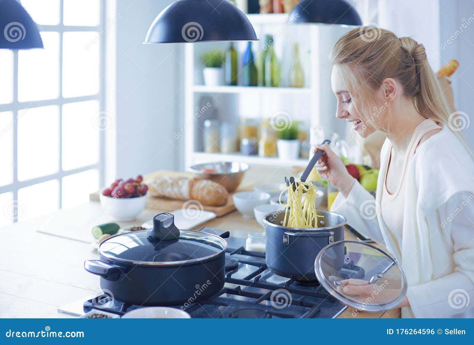 Beautiful Young Woman Cooking in Kitchen at Home Stock Photo - Image of ...