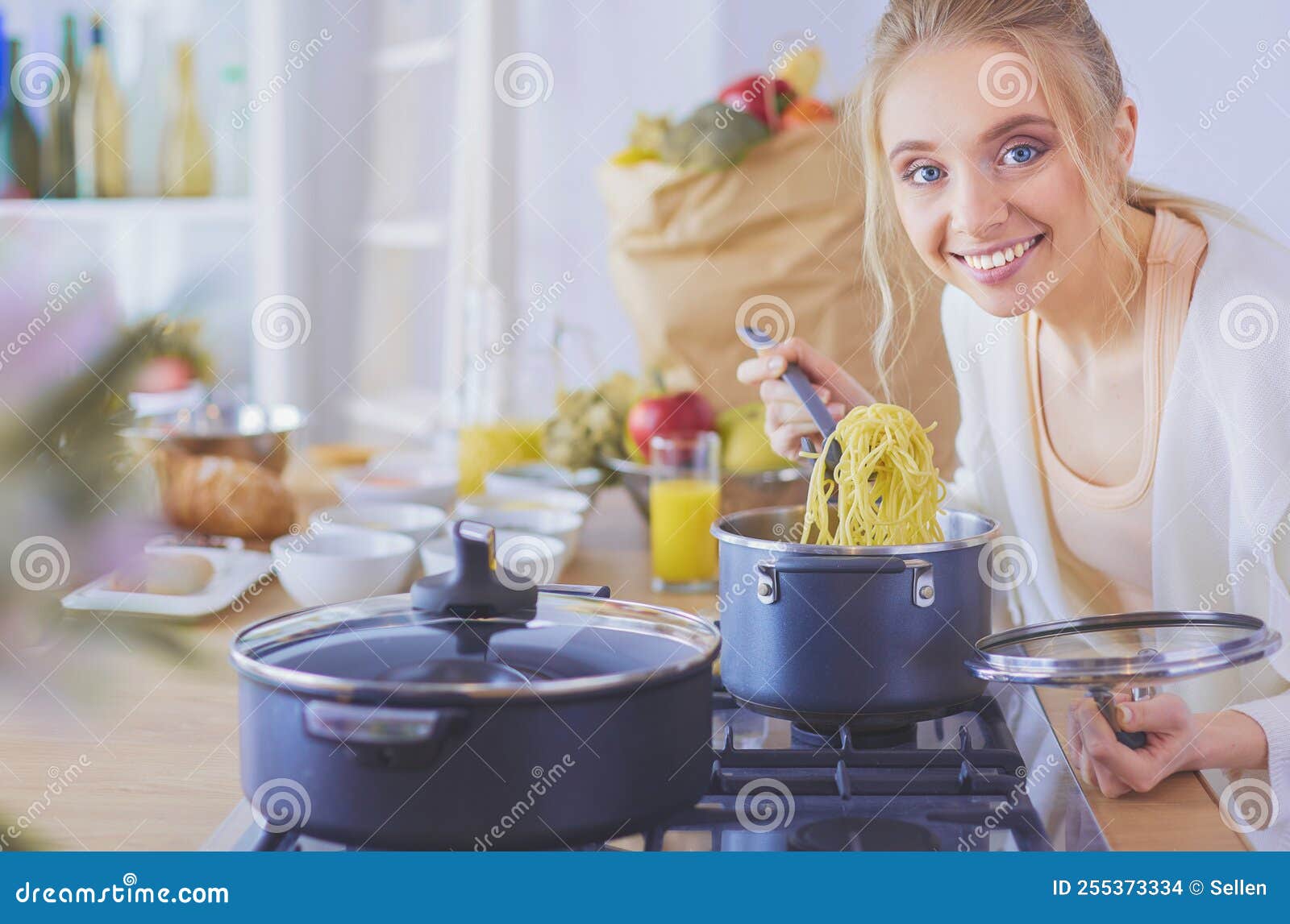 Beautiful Young Woman Cooking in Kitchen at Home Stock Photo - Image of ...
