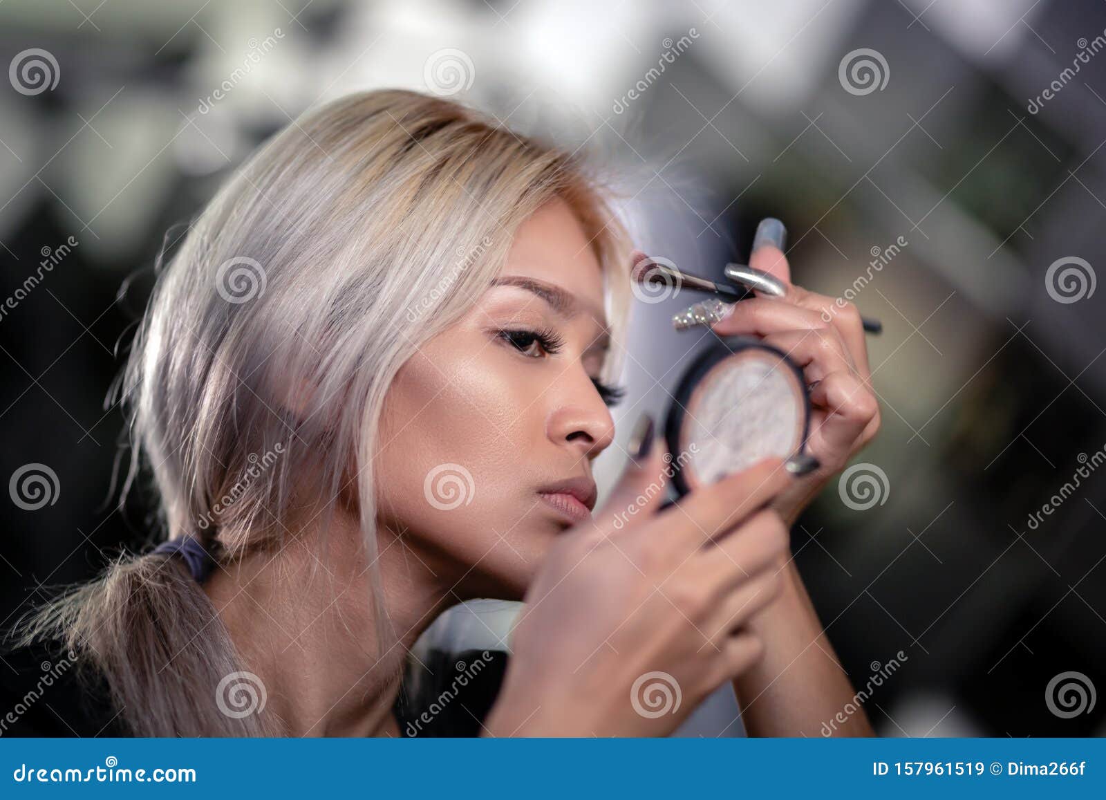 Beautiful Young Woman Doing Evening Makeup In Bathroom Stock Image