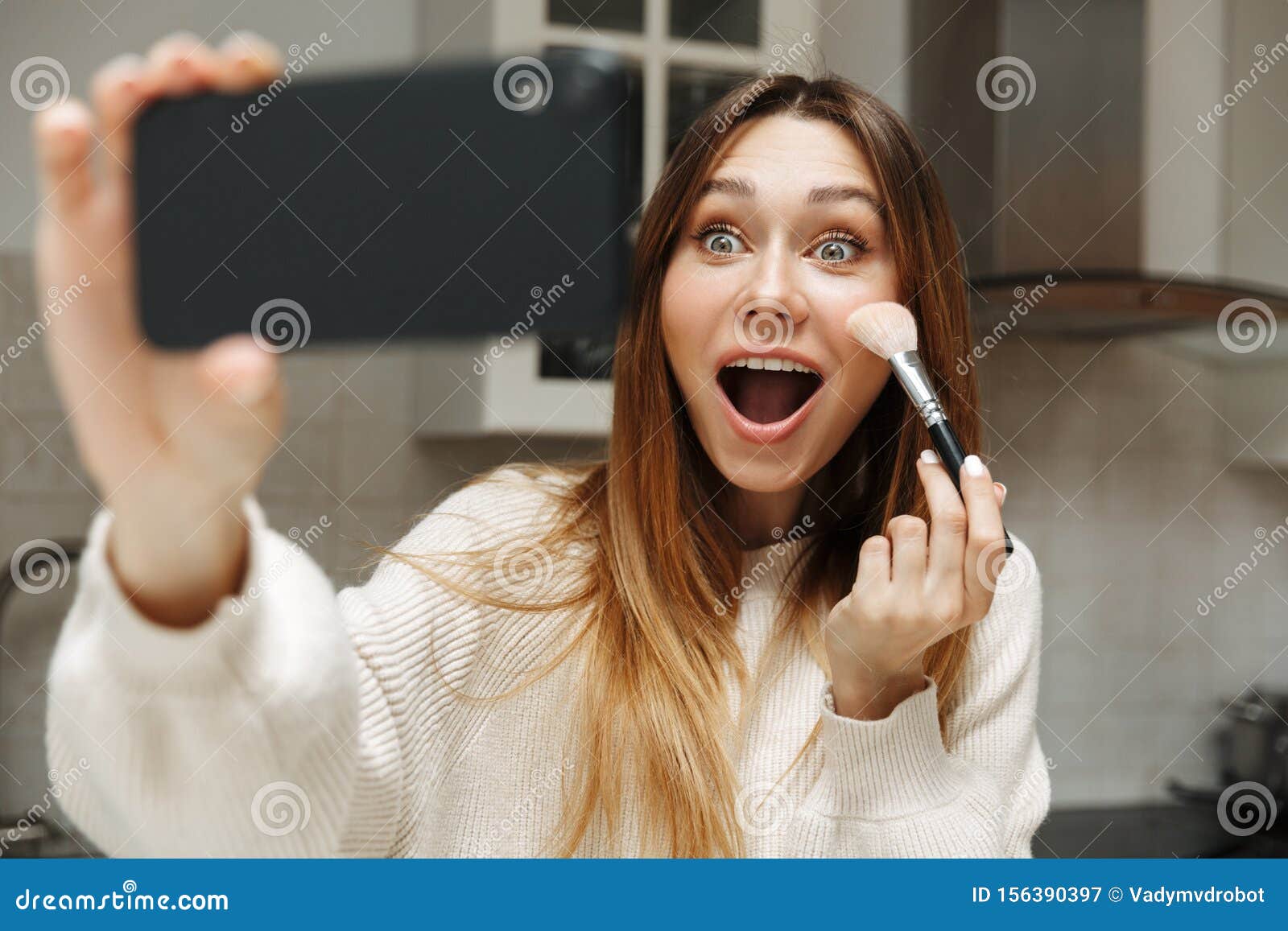 Beautiful Young Woman Doing Her Makeup at the Kitchen Stock Image ...