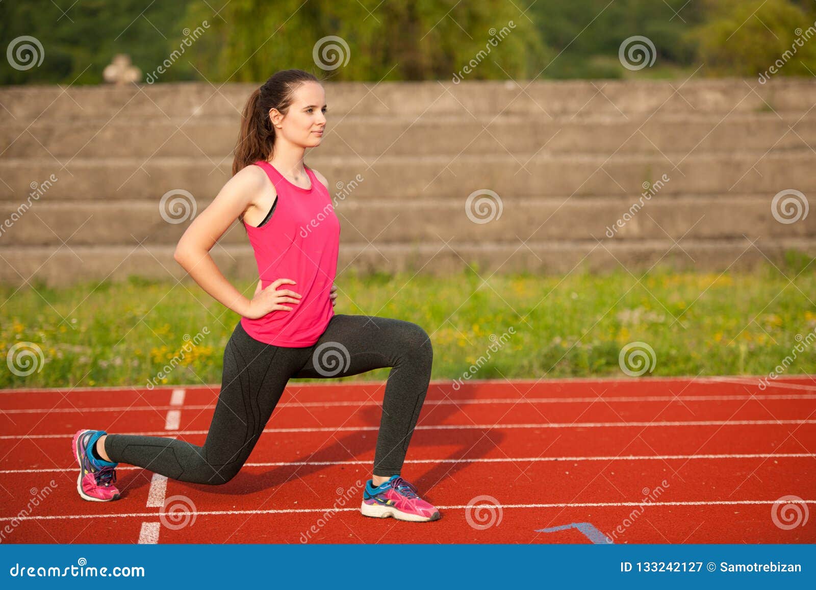 Beautiful Young Woman Doing Longe Step on Athletic Track Stock Image ...