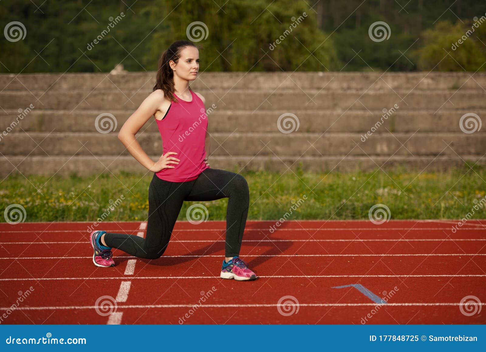 Beautiful Young Woman Doing Longe Step on Athletic Track Stock Image ...