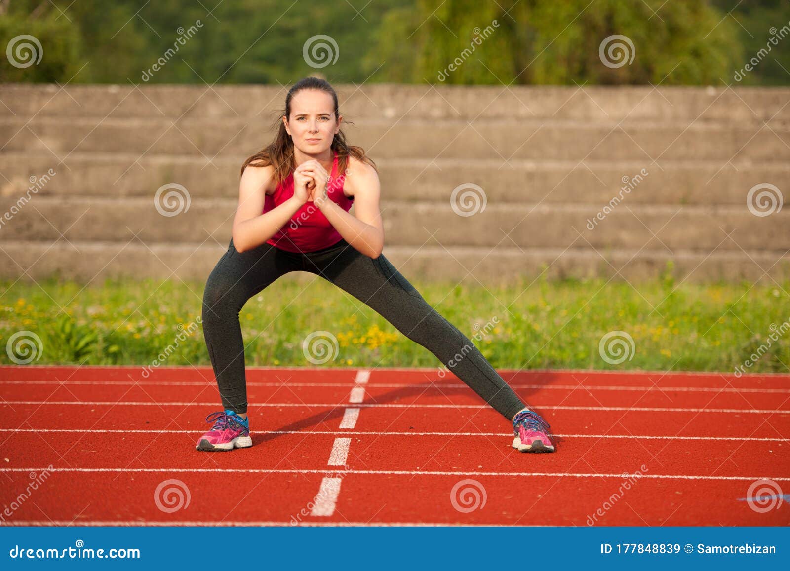 Beautiful Young Woman Doing Longe Step on Athletic Track Stock Image ...