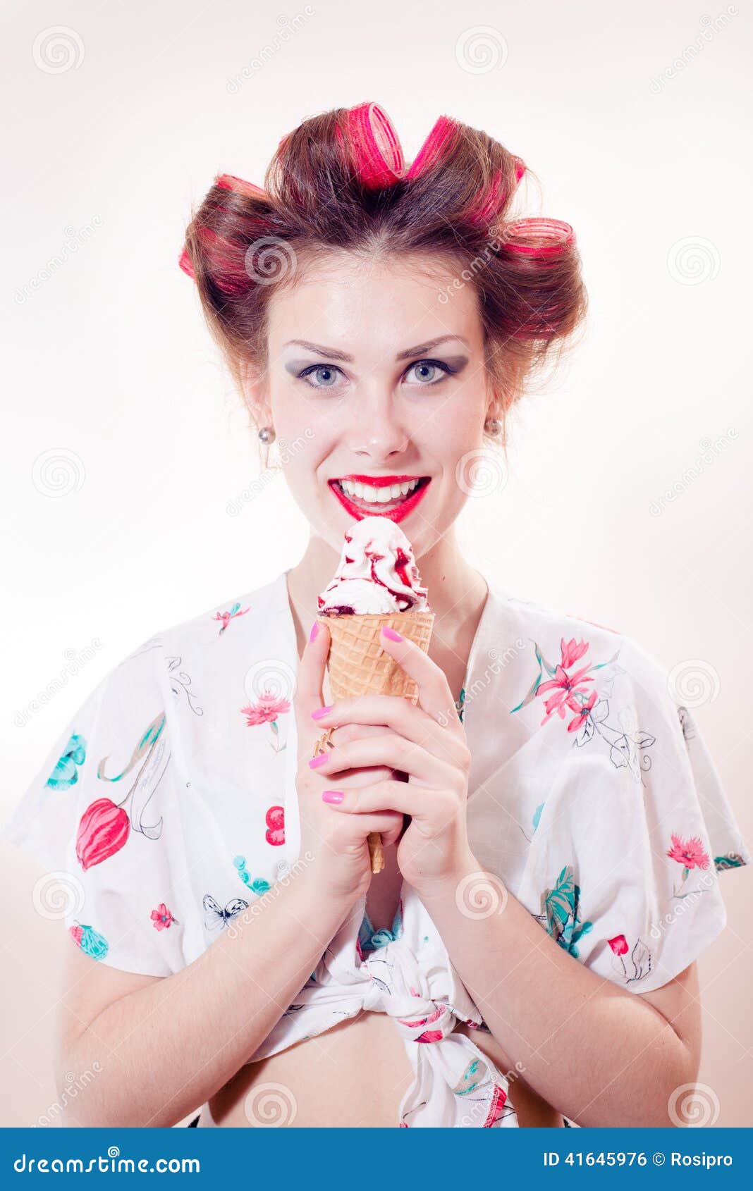 Beautiful Young Woman Eating Ice Cream Cone Looking In Camera Isolated