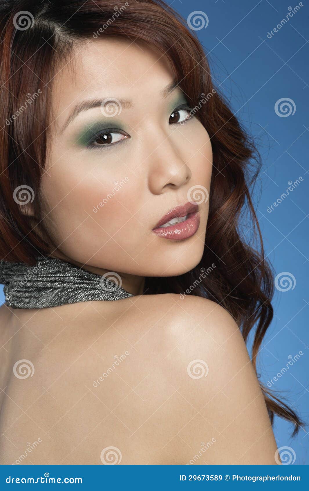 Beautiful Young Woman with Eye Shadow Looking Back Over Colored ...