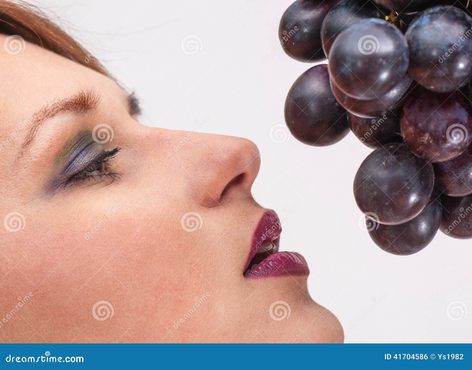 A Beautiful Young Woman Face with Grape Stock Photo - Image of hand ...
