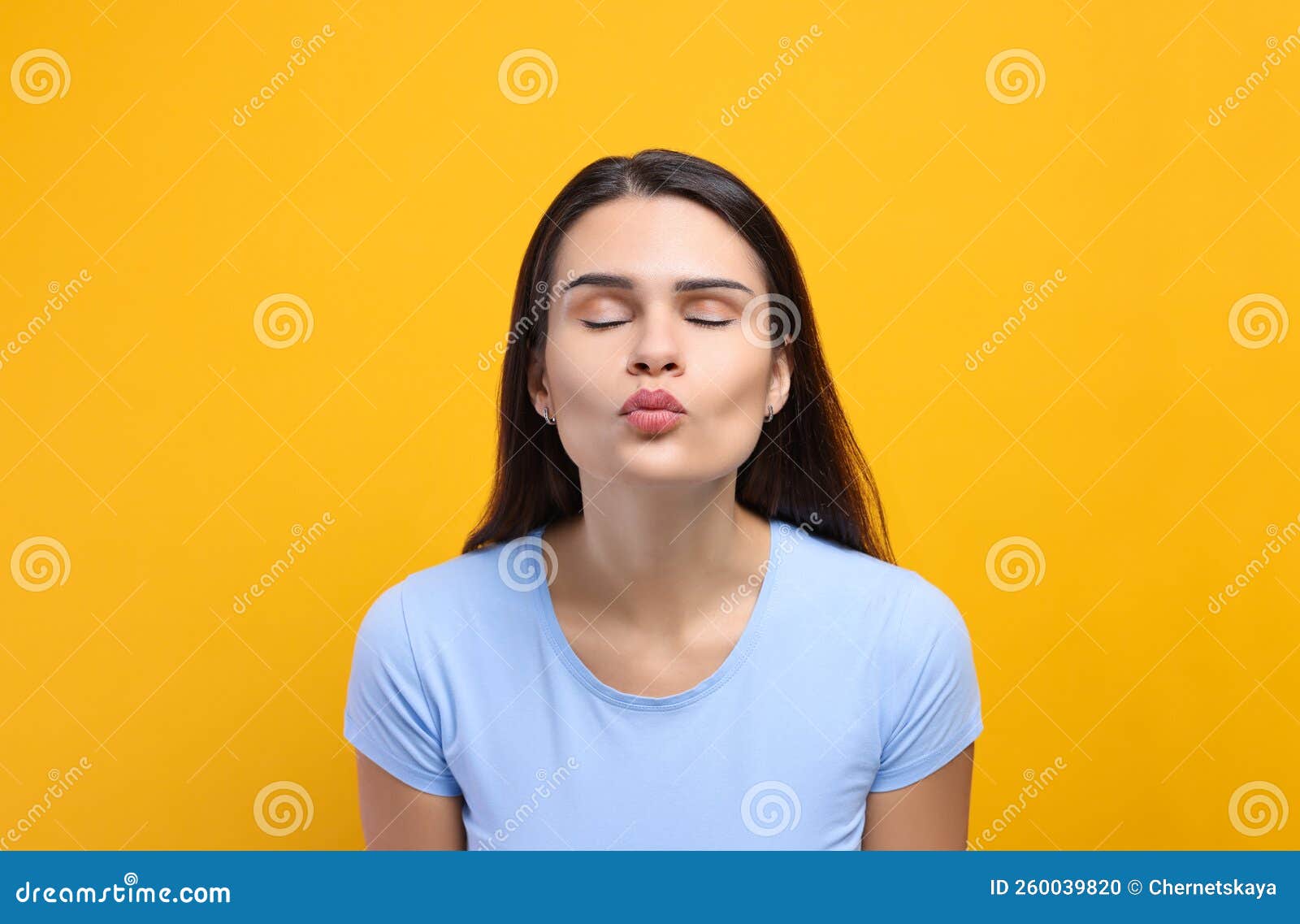 Beautiful Young Woman Giving Kiss on Yellow Background Stock Photo ... Beautiful Young Woman Giving Kiss on Yellow Background Stock Photo ...