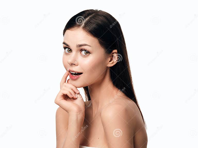 Young Woman Posing With Hand On Chin And Looking At Camera Isolated White Background Stock