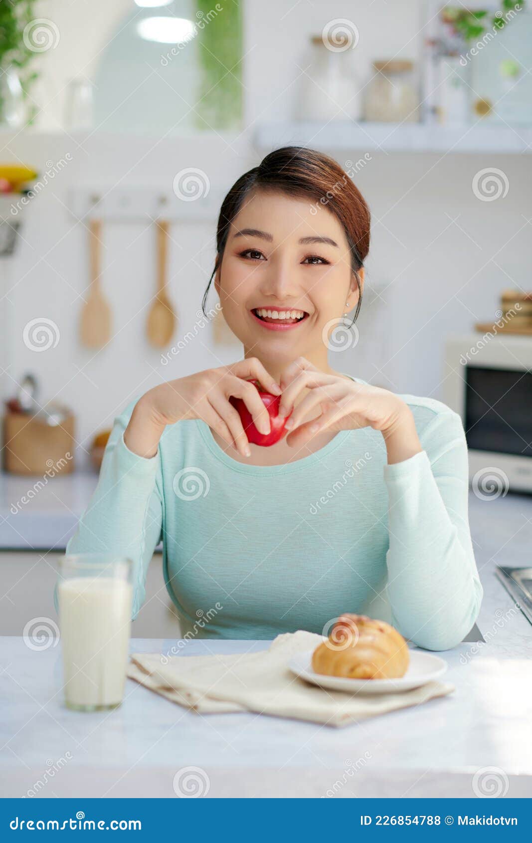 Beautiful Young Woman Having Breakfast in Kitchen Stock Photo - Image ...