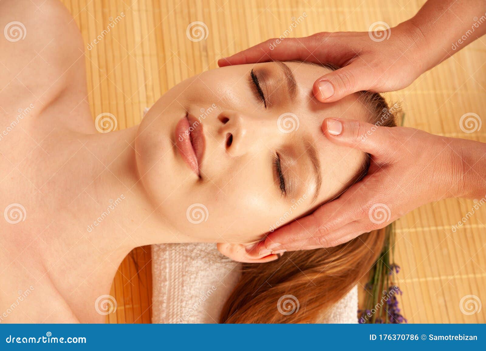 Beautiful Young Woman Having A Face Massage In Spa Salon Wellness