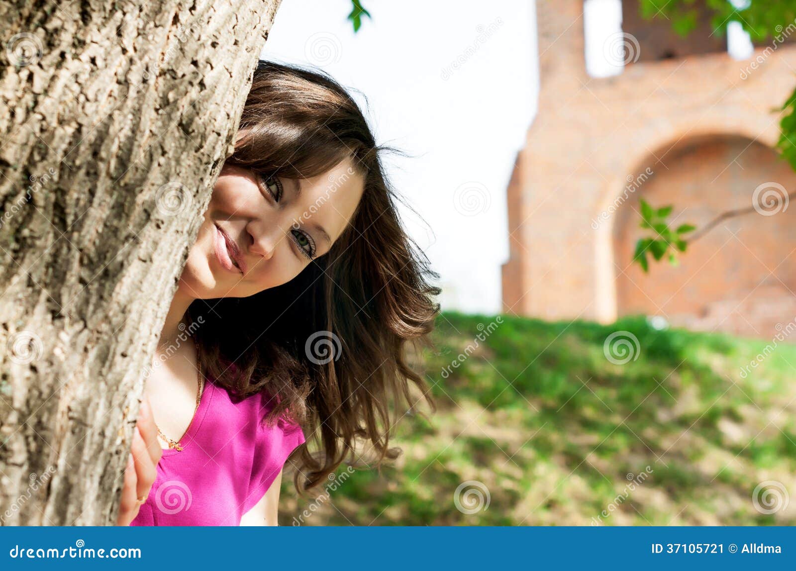 Beautiful Young Woman Hiding Behind a Tree Stock Image - Image of place ...