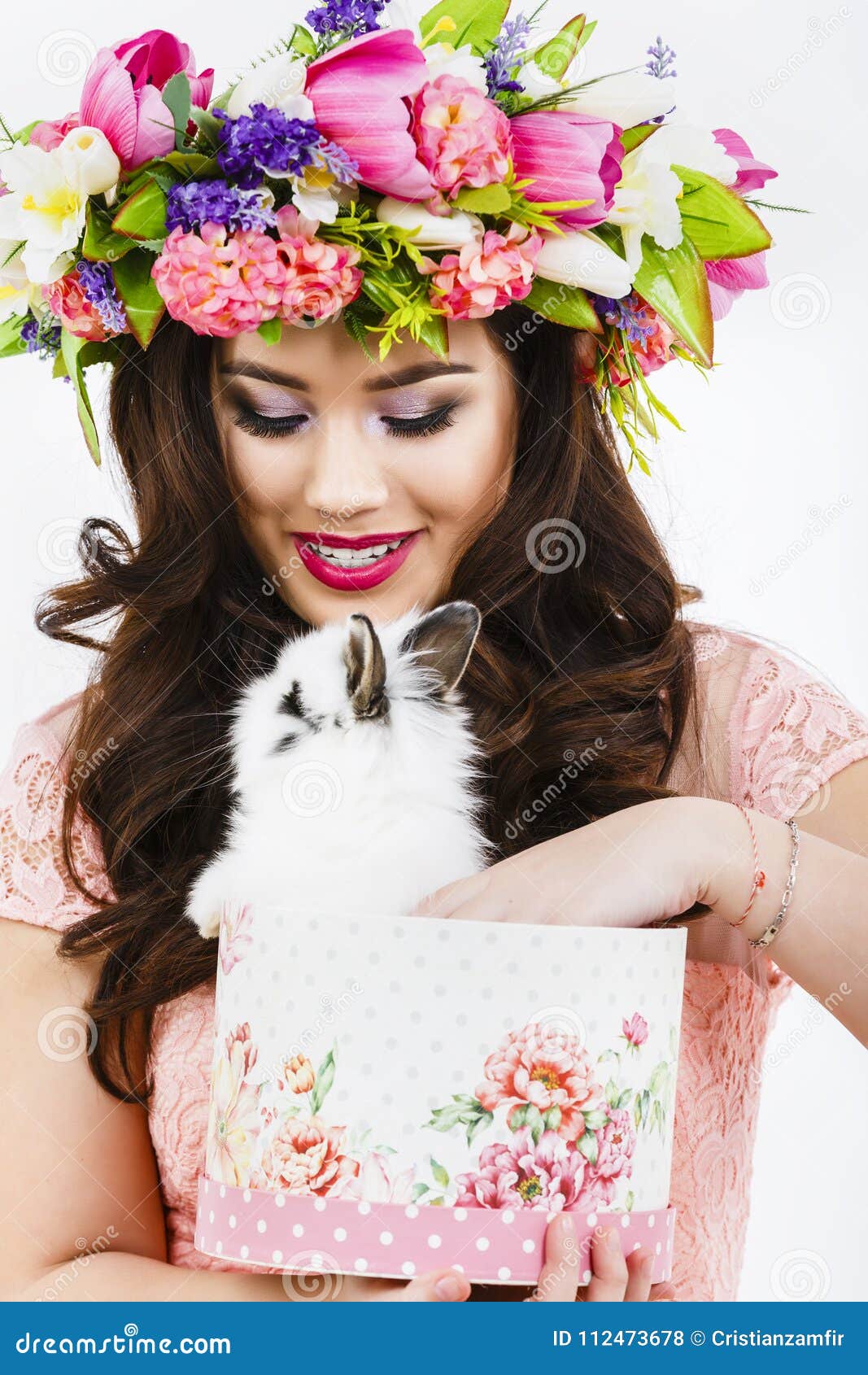 Beautiful Young Woman Holding a Gift Box with a Rabbit Stock Photo ...