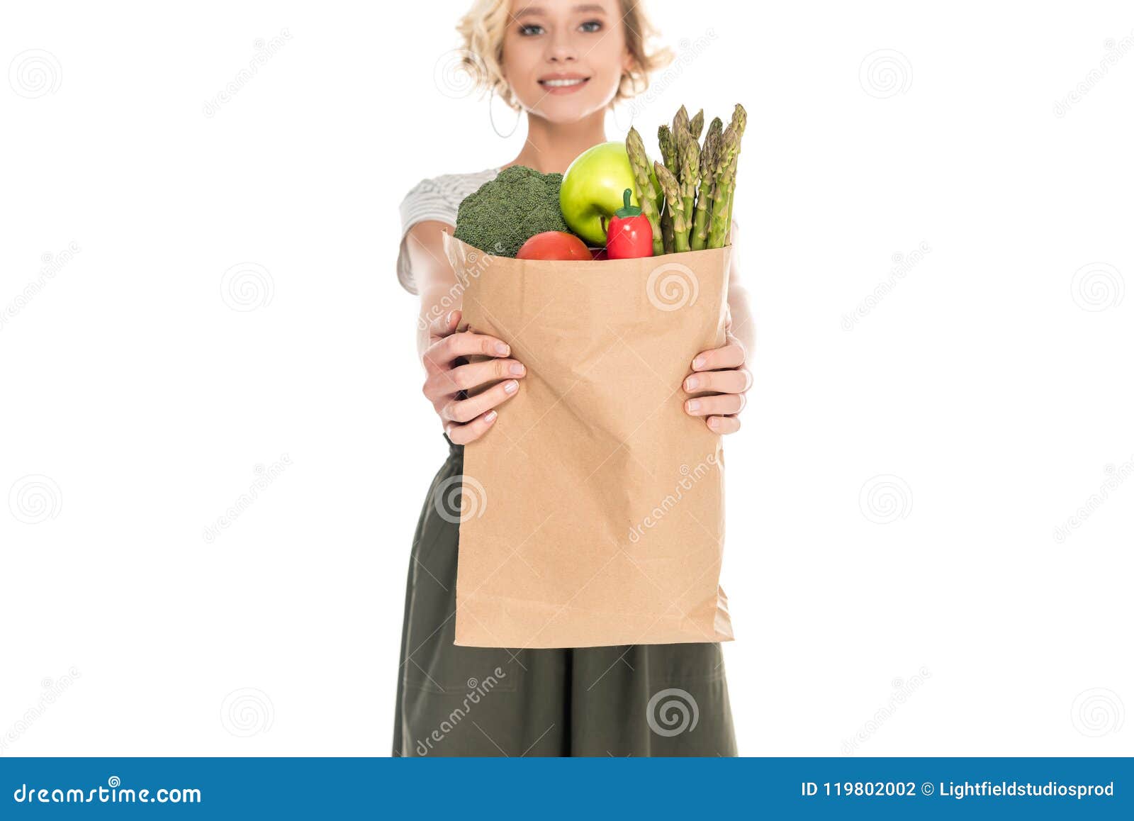 Beautiful Young Woman Holding Grocery Bag and Smiling at Camera Stock ... Beautiful Young Woman Holding Grocery Bag and Smiling at Camera Stock ...