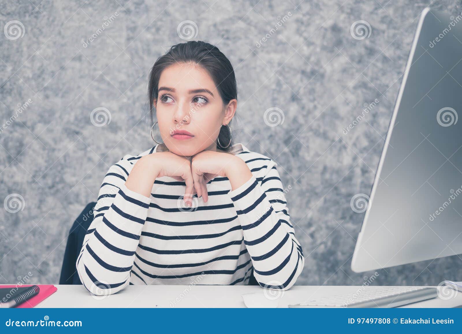 Beautiful Young Woman Looking at a Computer Screen and Thinking at the ...