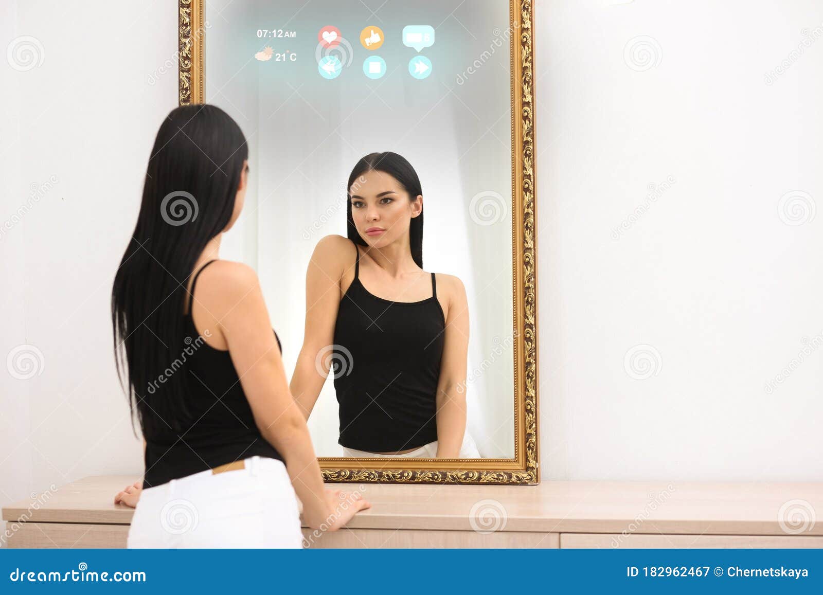 Beautiful Woman Looking At Herself In Smart Mirror Indoors Stock Image