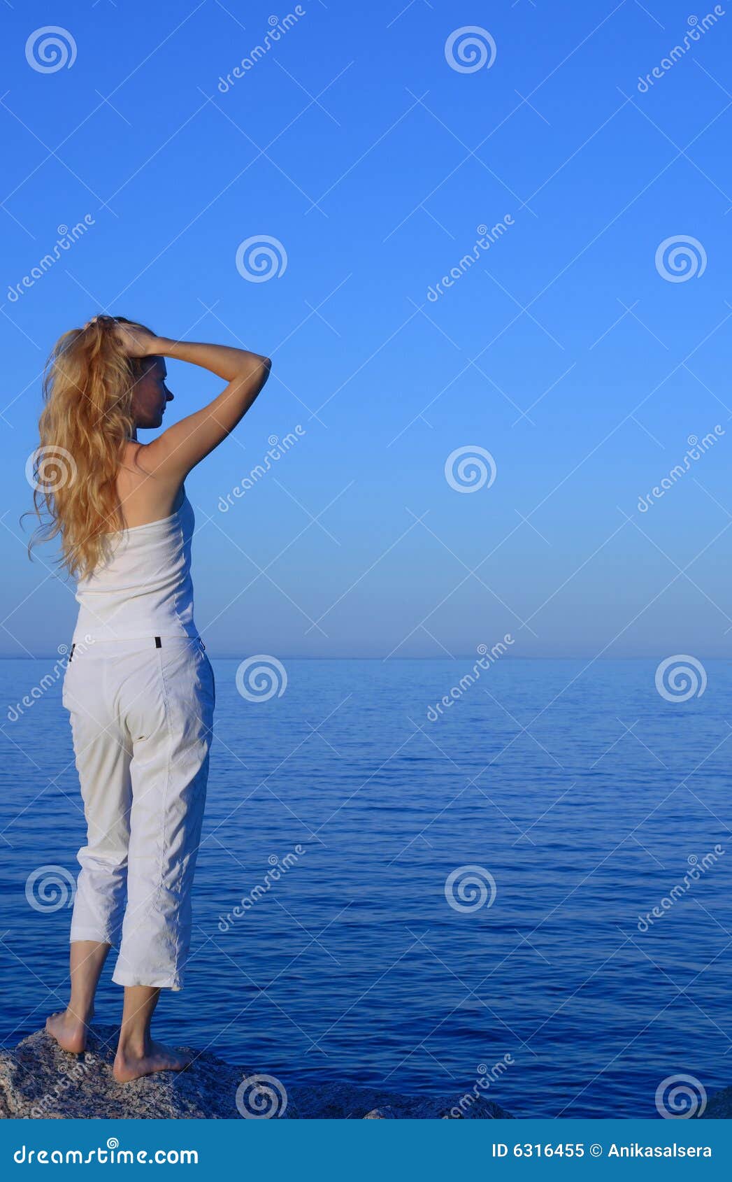 Beautiful Young Woman Looking at the Sea Stock Image - Image of evening ...