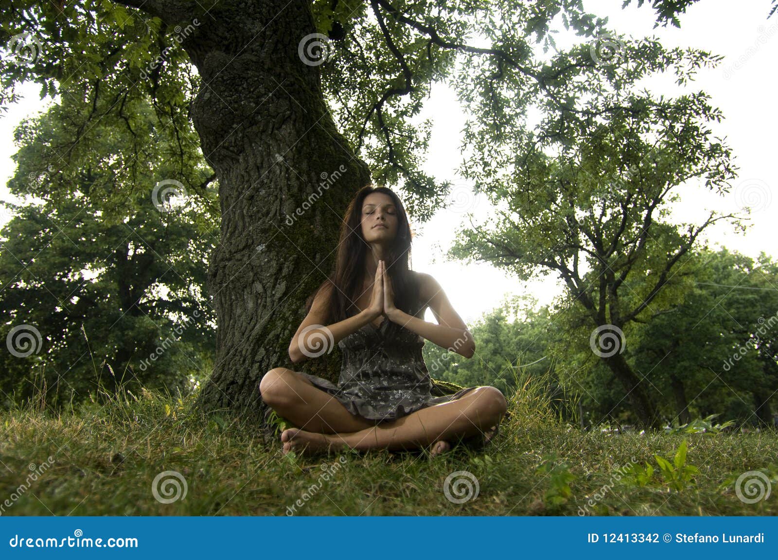 Beautiful Young Woman Meditating in Nature Stock Photo - Image of cross ...
