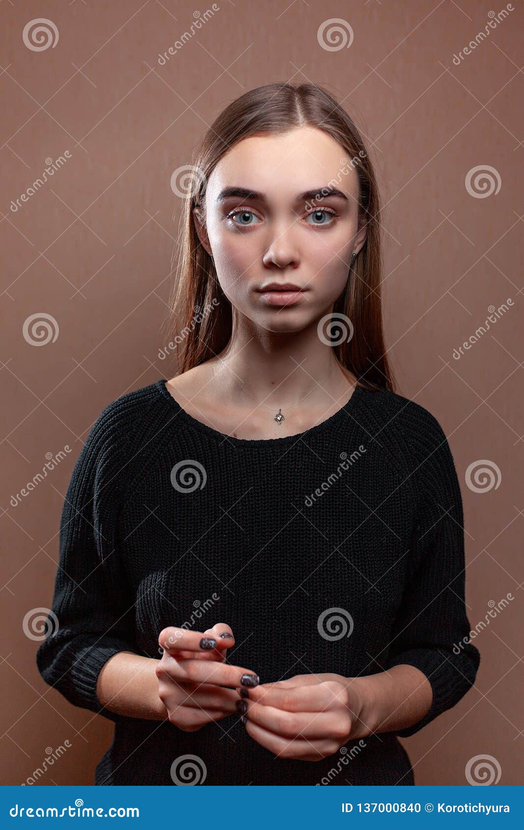 Beautiful Young Woman Mysteriously Looks into the Frame Stock Photo ... Beautiful Young Woman Mysteriously Looks into the Frame Stock Photo ...