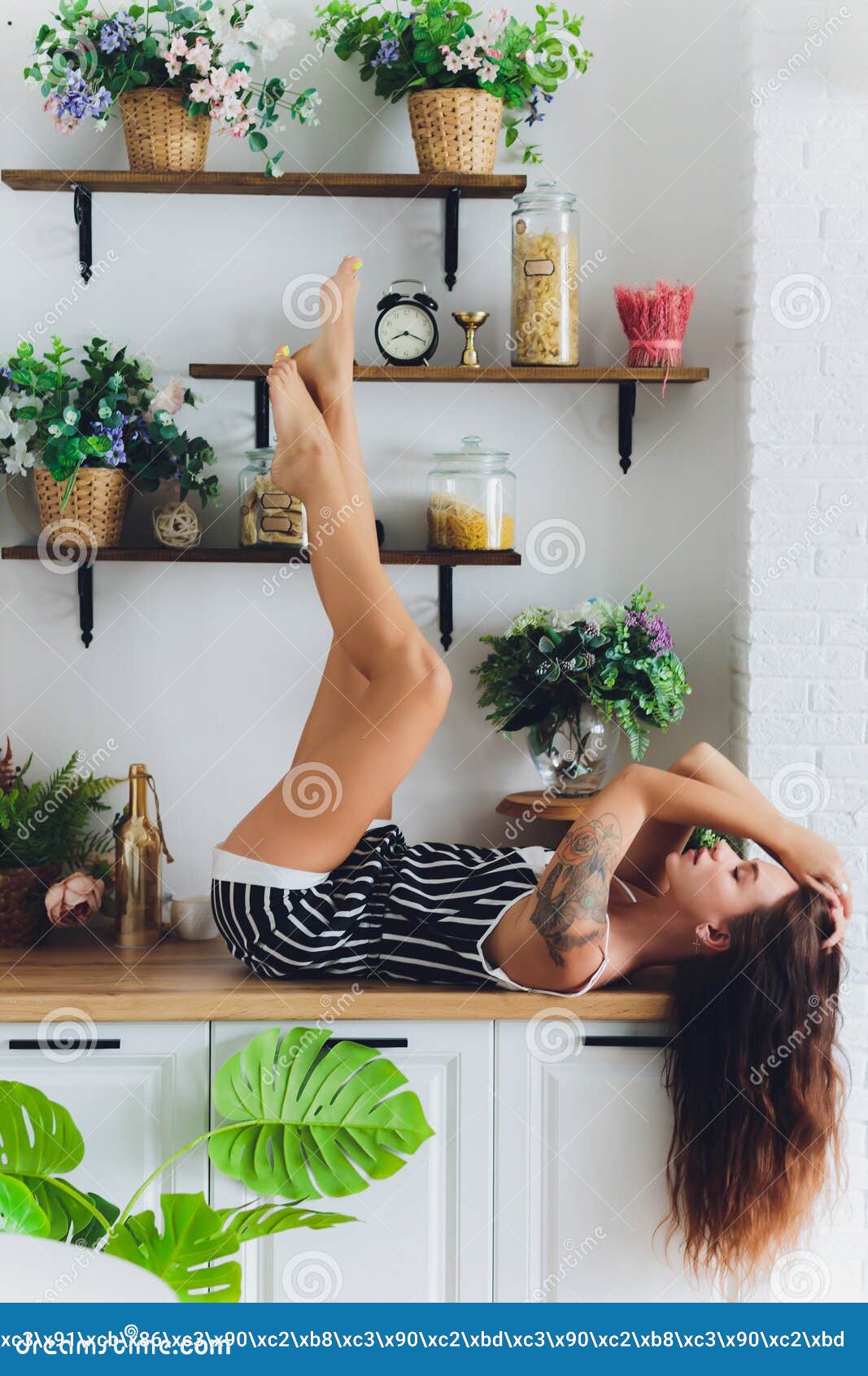 Beautiful Young Woman in Pajamas in Kitchen. Stock Photo - Image of ...