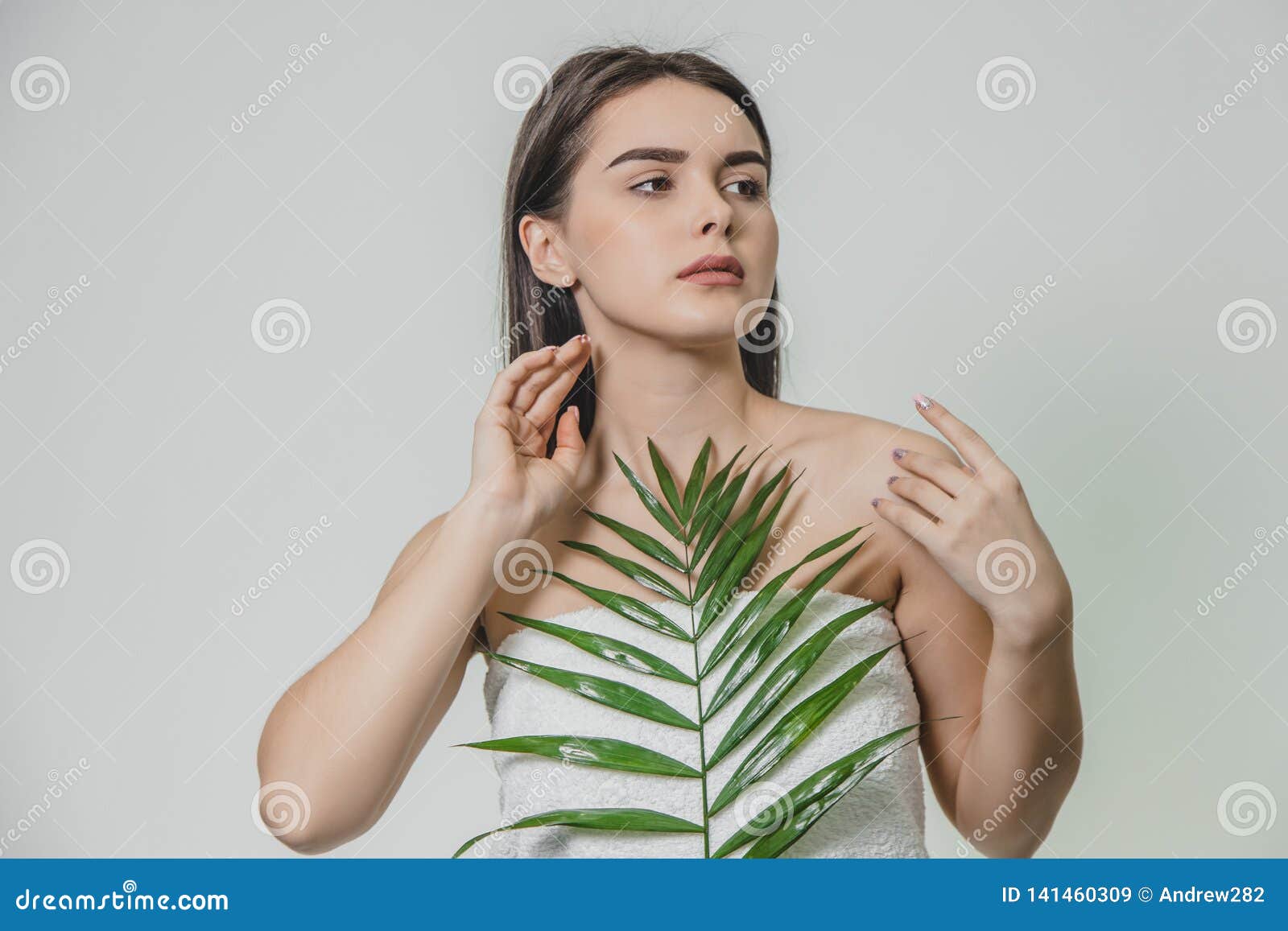 Beautiful Young Woman With Perfect Skin And Natural Make Up Posing On A