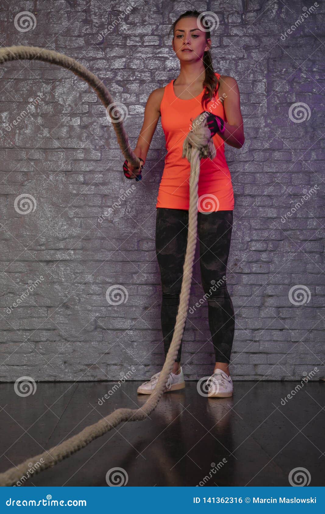 Beautiful Young Woman Practicing with a Thick Rope Stock Photo - Image ...