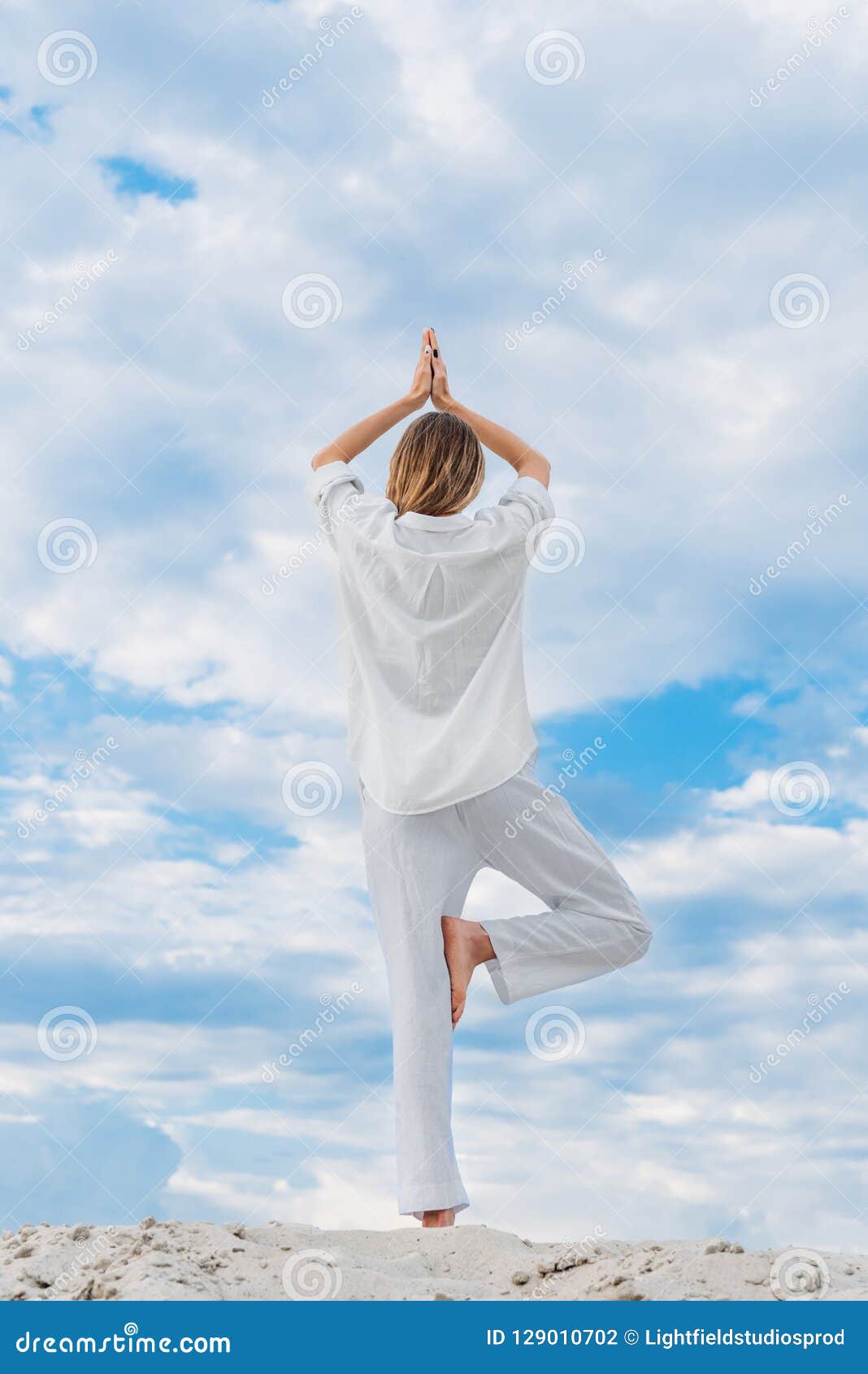 Beautiful Young Woman Practicing Yoga in Tree Pose while Standing Stock ...