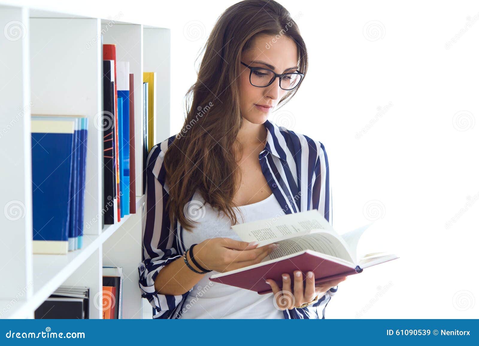 Beautiful Young Woman Reading in the Library. Stock Image - Image of ...