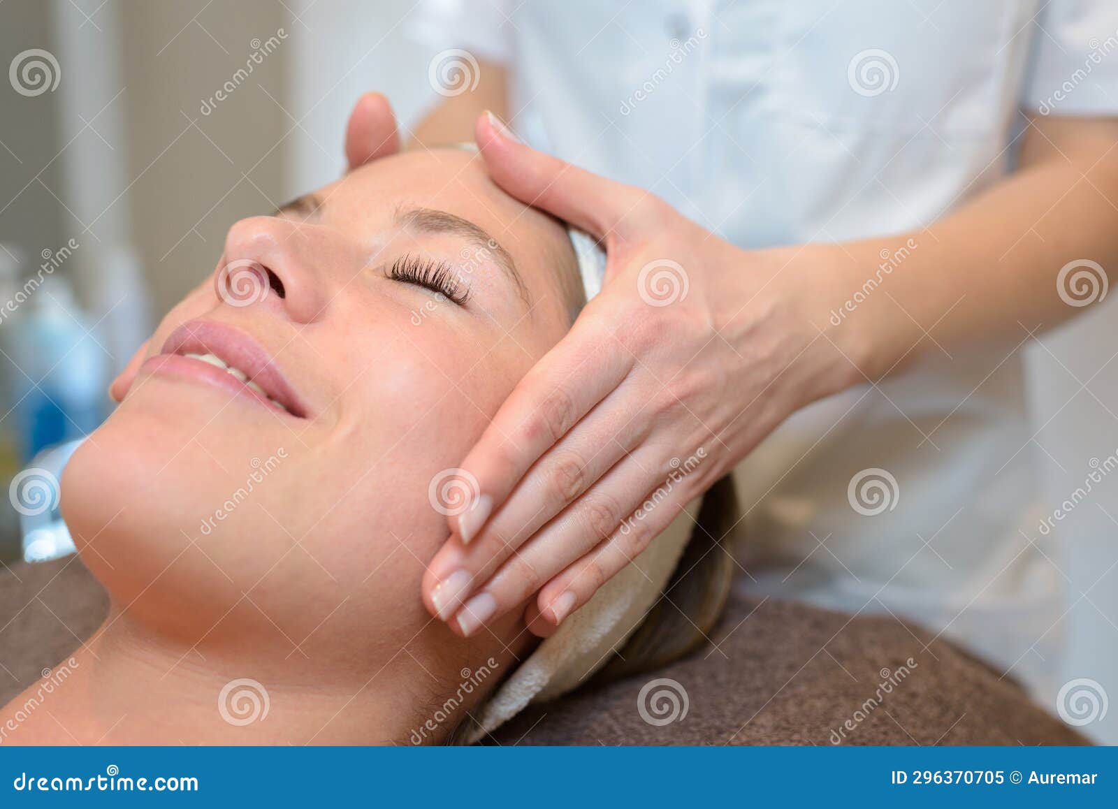 Beautiful Young Woman Receiving Head Massage At Health Spa Stock Image