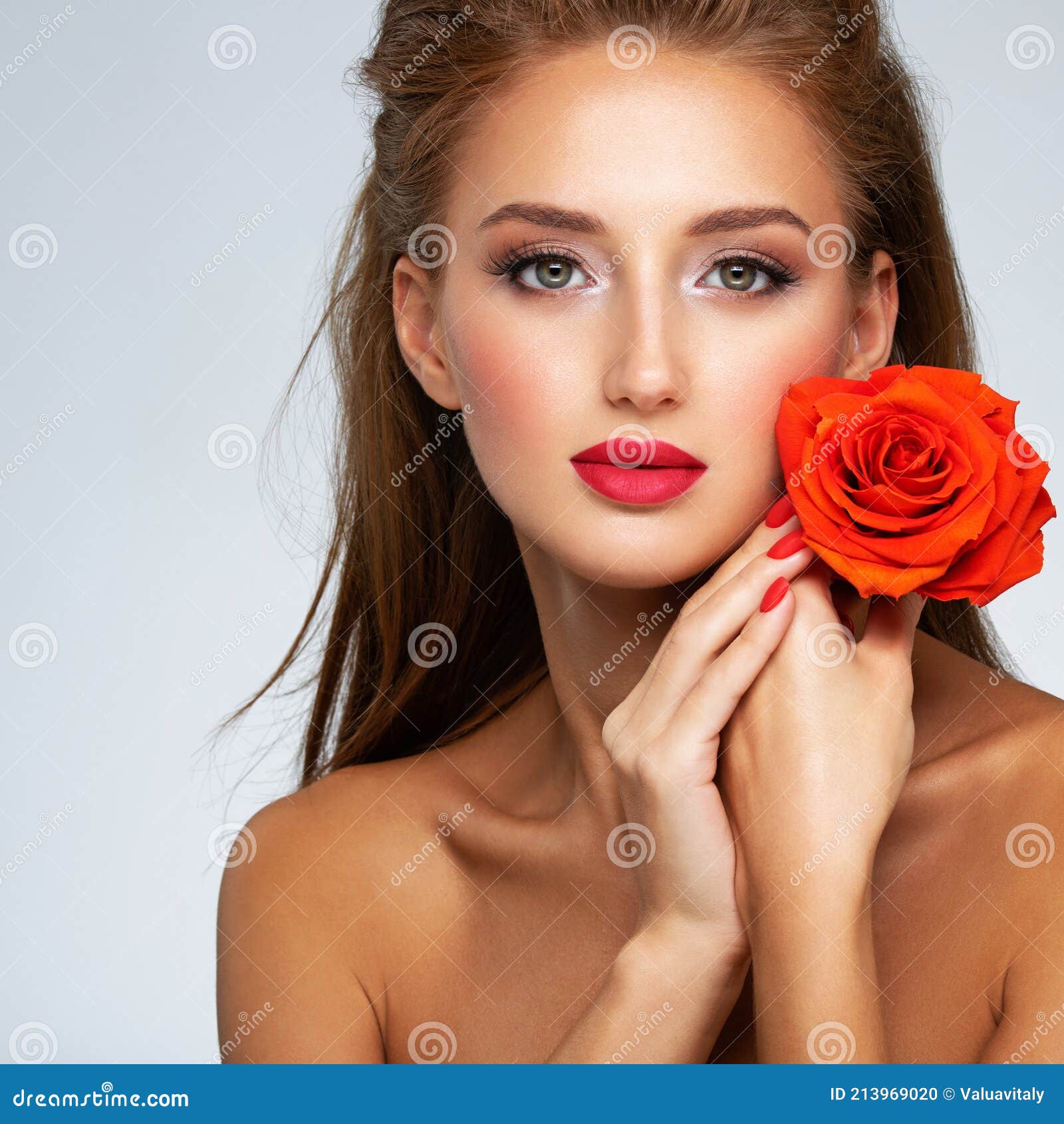 Beautiful Young Woman With A Red Flower In Hand Near Face Portrait Of