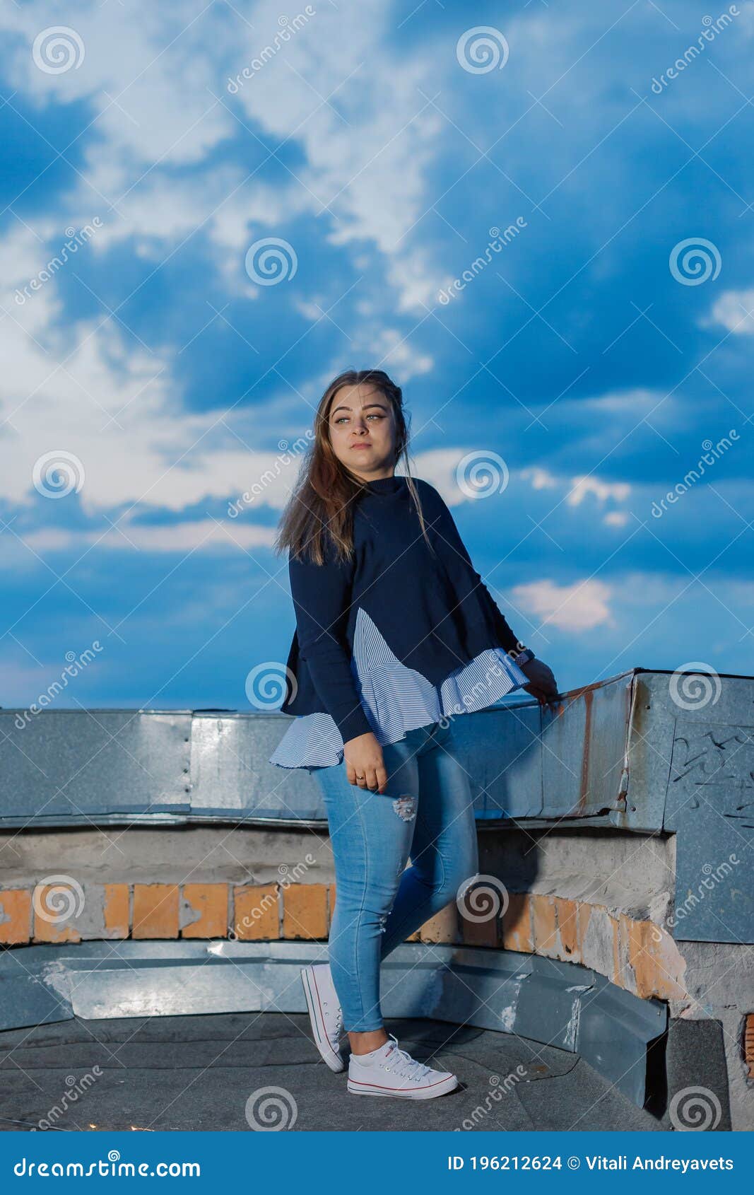 Beautiful Young Woman on the Rooftop in the Evening. Stock Photo ...