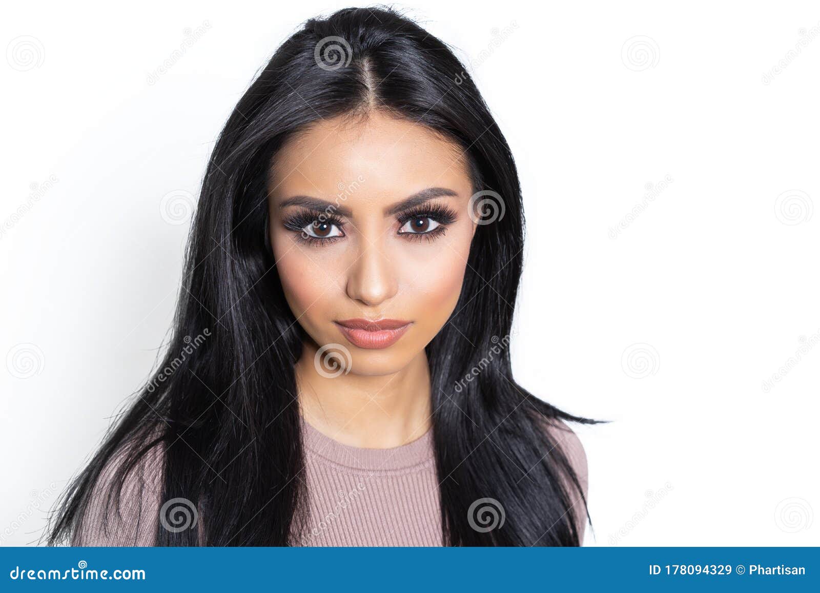 Beautiful Young Woman`s Face With Gorgeous Black Hair Stock Image