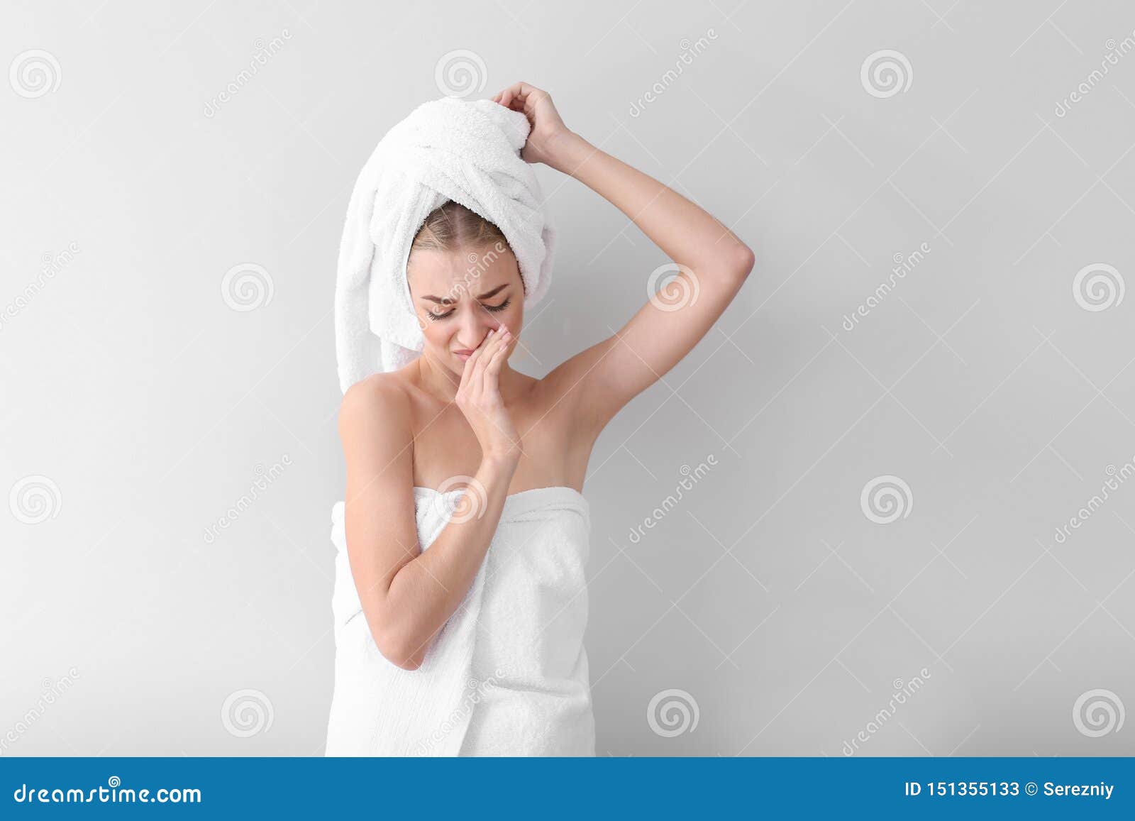 Beautiful Young Woman After Shower Feeling Smell Of Sweat On Light Background Concept Of Using