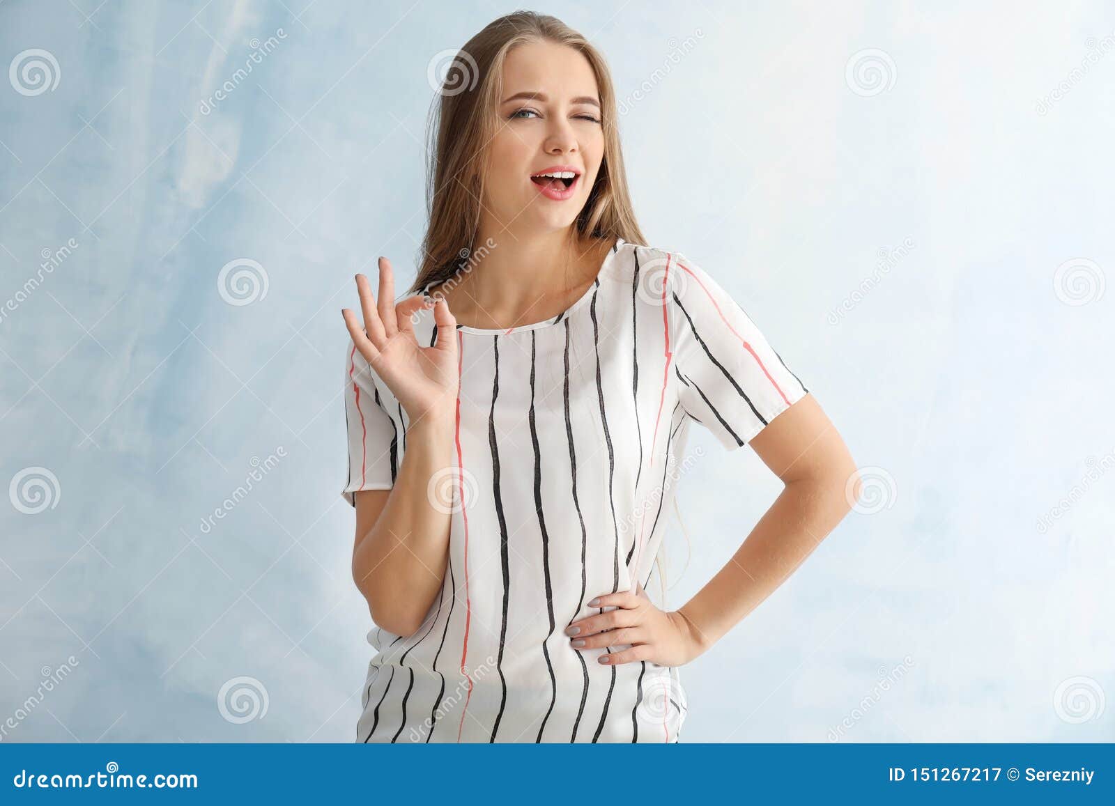 Beautiful Young Woman Showing Ok Gesture On Color Background Stock