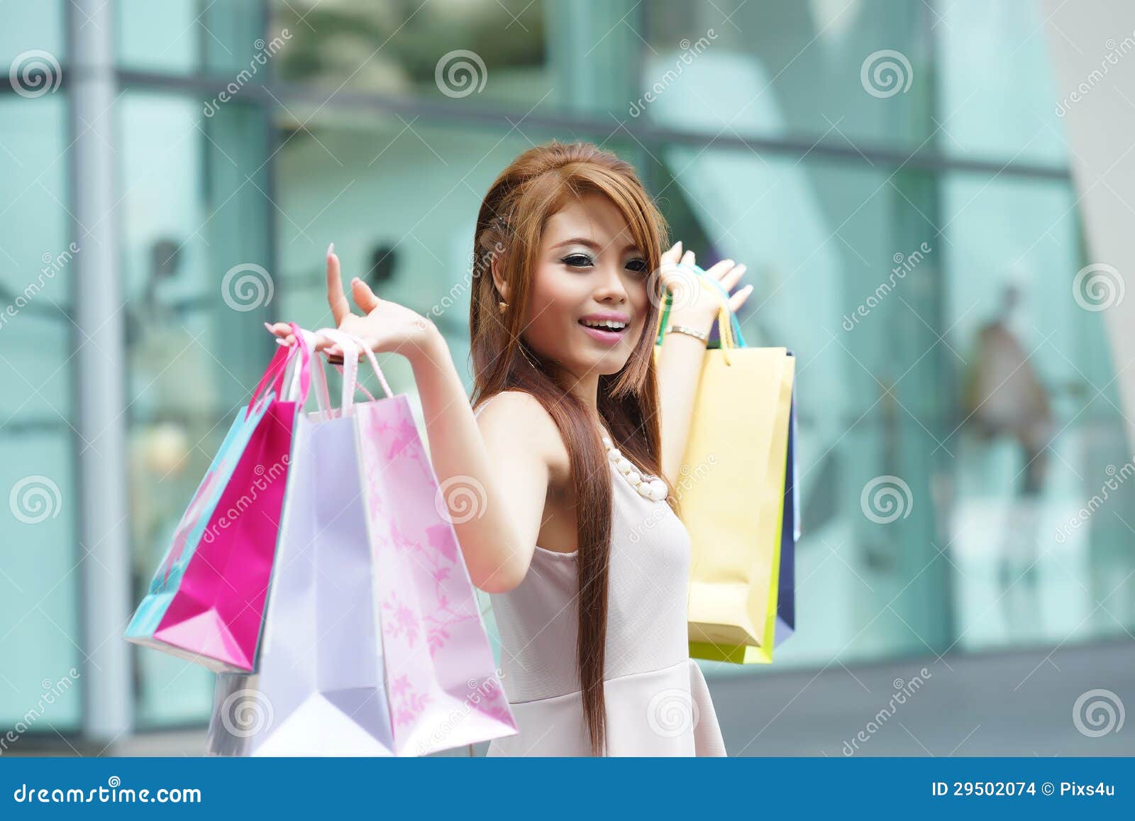 Beautiful Young Woman Shows an Ecstatic Expression while Holding Stock ...