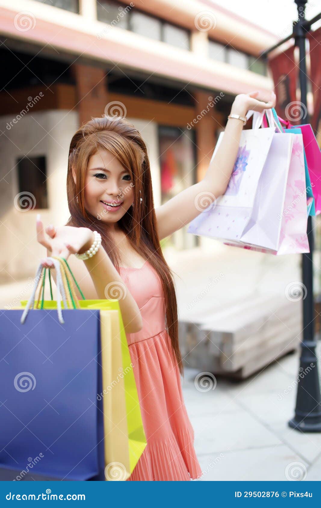 Beautiful Young Woman Shows an Ecstatic Expression while Holding Stock ...