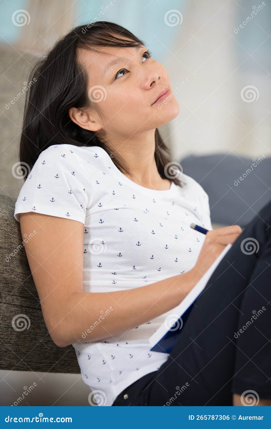 Beautiful Young Woman Siting on Couch Thinking Stock Photo - Image of ...