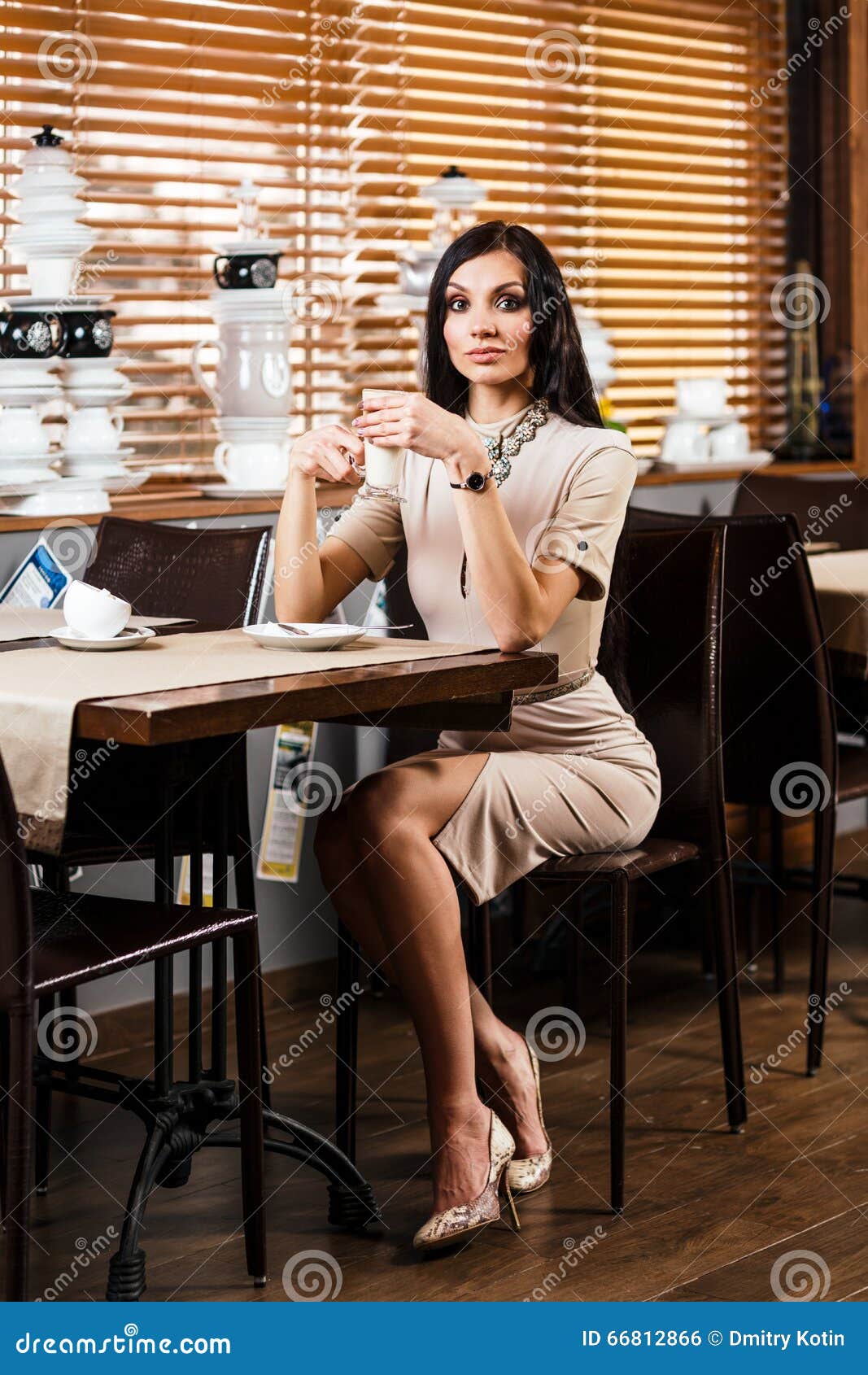 Beautiful Young Woman Sitting in the Cafe Stock Photo - Image of ...