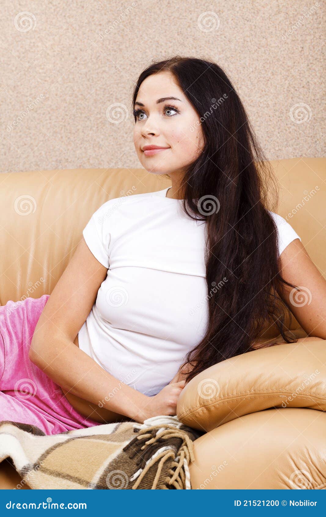 Beautiful Young Woman Sitting on the Couch Stock Photo - Image of ... Beautiful Young Woman Sitting on the Couch Stock Photo - Image of ...