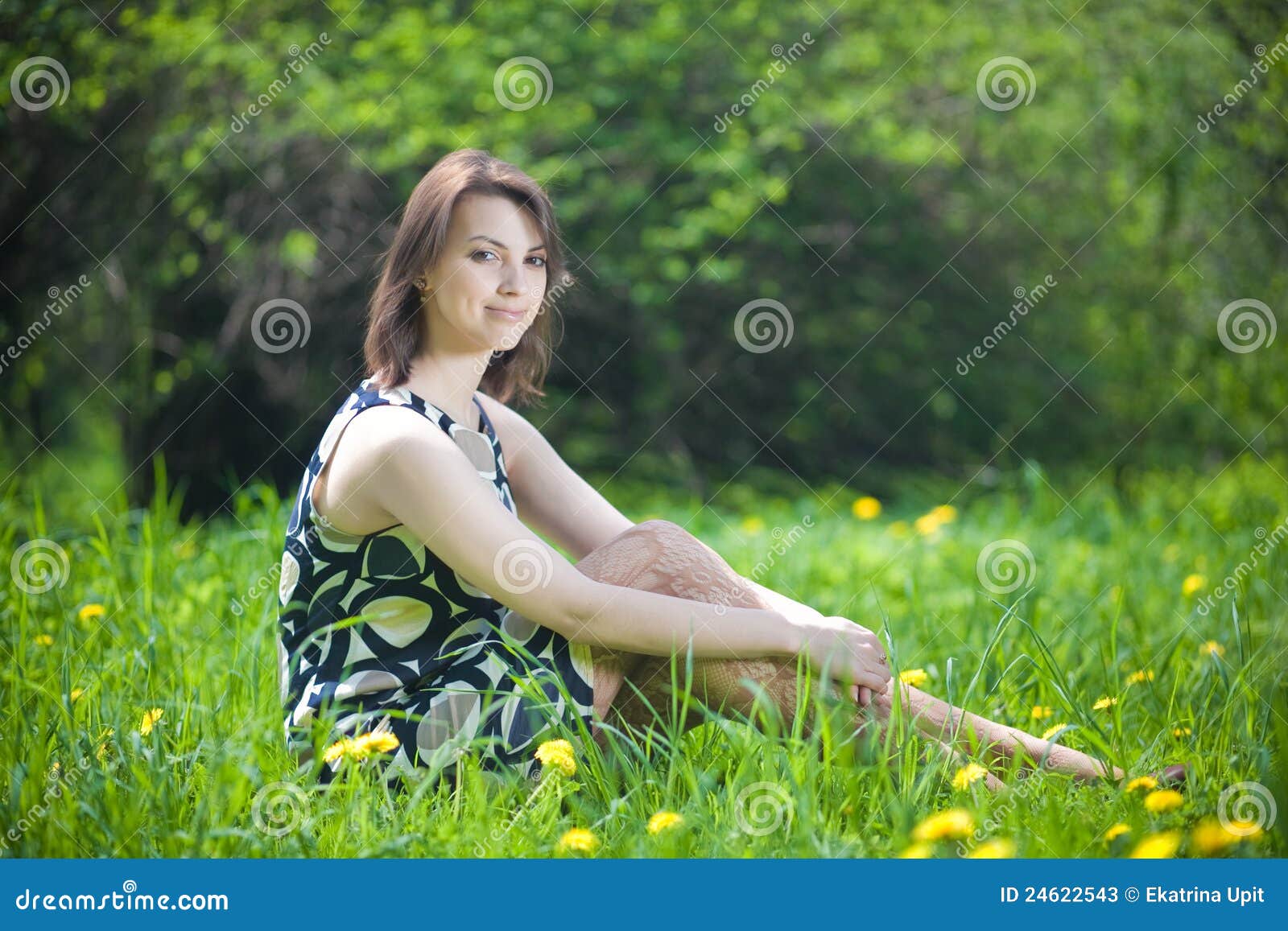 Beautiful Young Woman Sitting on the Grass Stock Image - Image of ...