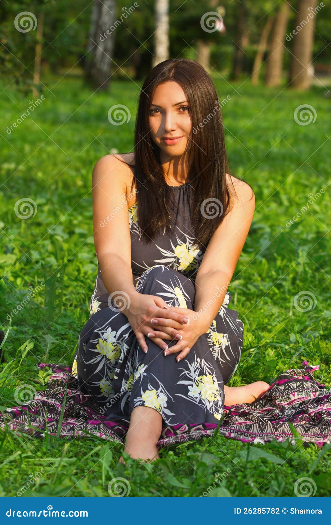 Beautiful Young Woman Sitting on the Grass Stock Photo - Image of ...