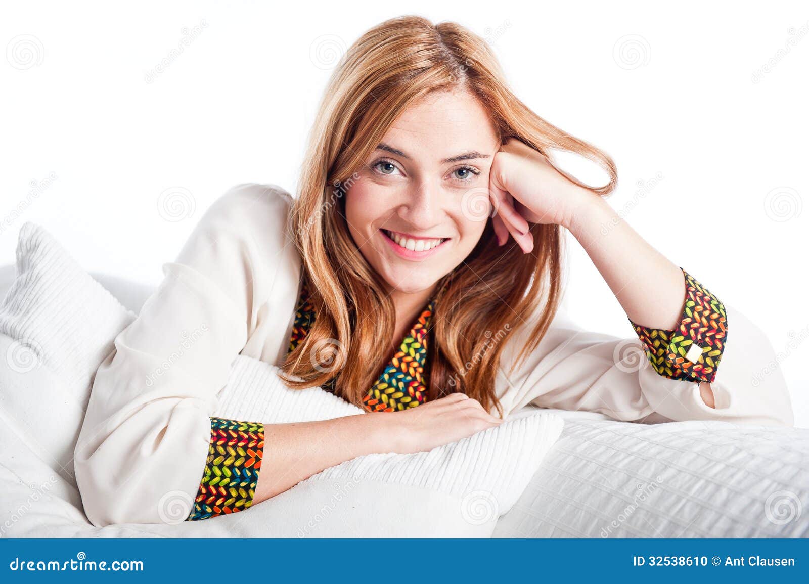 Beautiful Young Woman Smiling and Relaxing on a Sofa Stock Photo ...