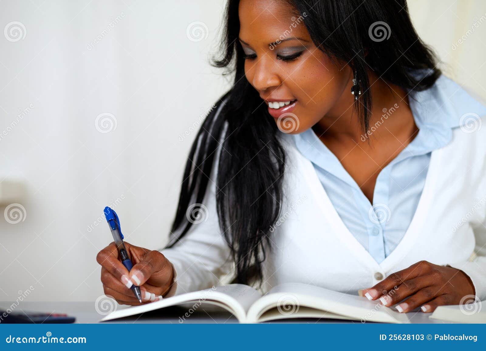 Beautiful Young Woman Smiling and Studying Stock Image - Image of ...