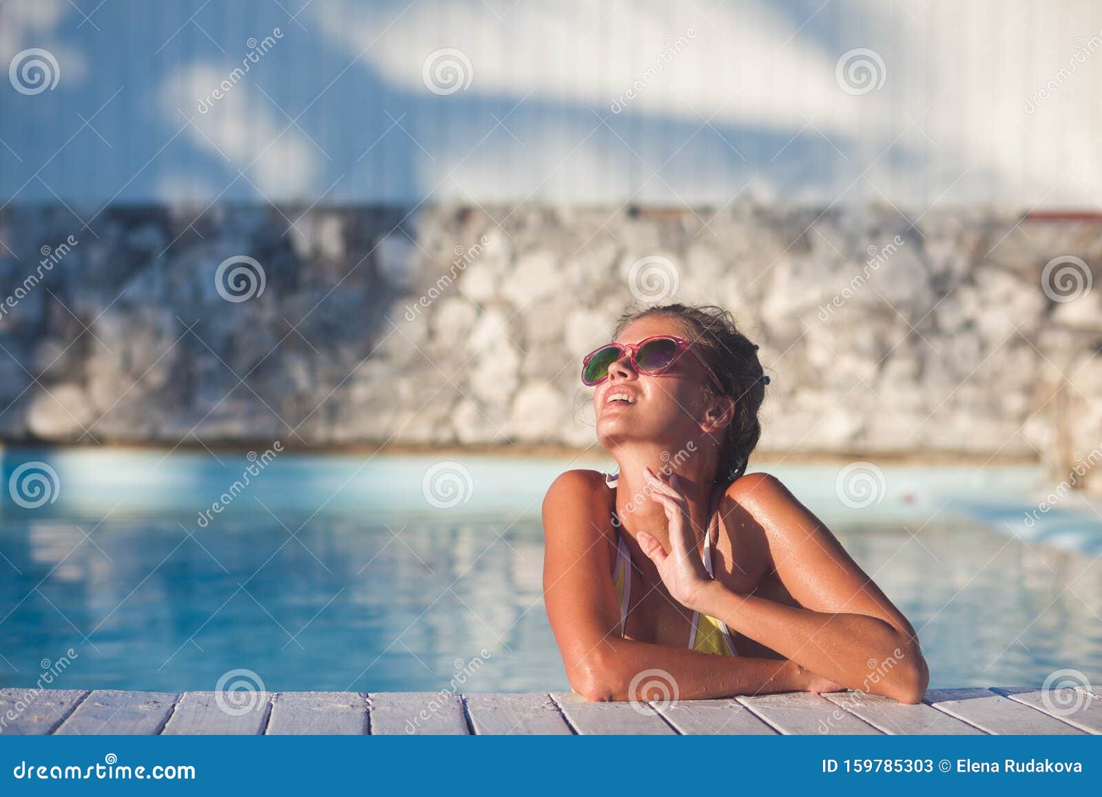 Beautiful Young Woman In Sunglasses With Flower In Hair Smiling In