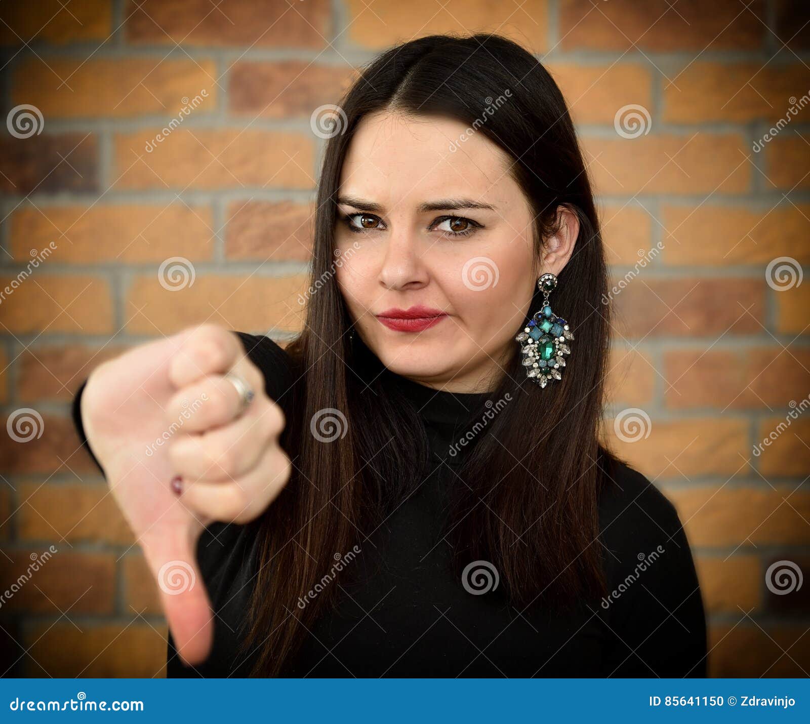 Beautiful Young Woman with Thumb Down. Stock Photo - Image of ...