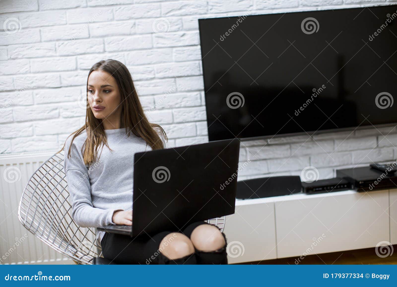 Beautiful Young Woman Using Laptop at Home Stock Photo - Image of calm ...