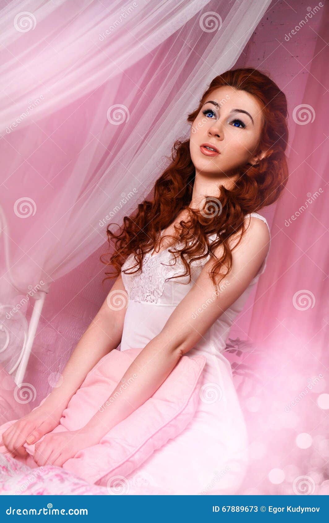 Beautiful Young Woman Wearing White Lingerie Lying In Bed Stock Image