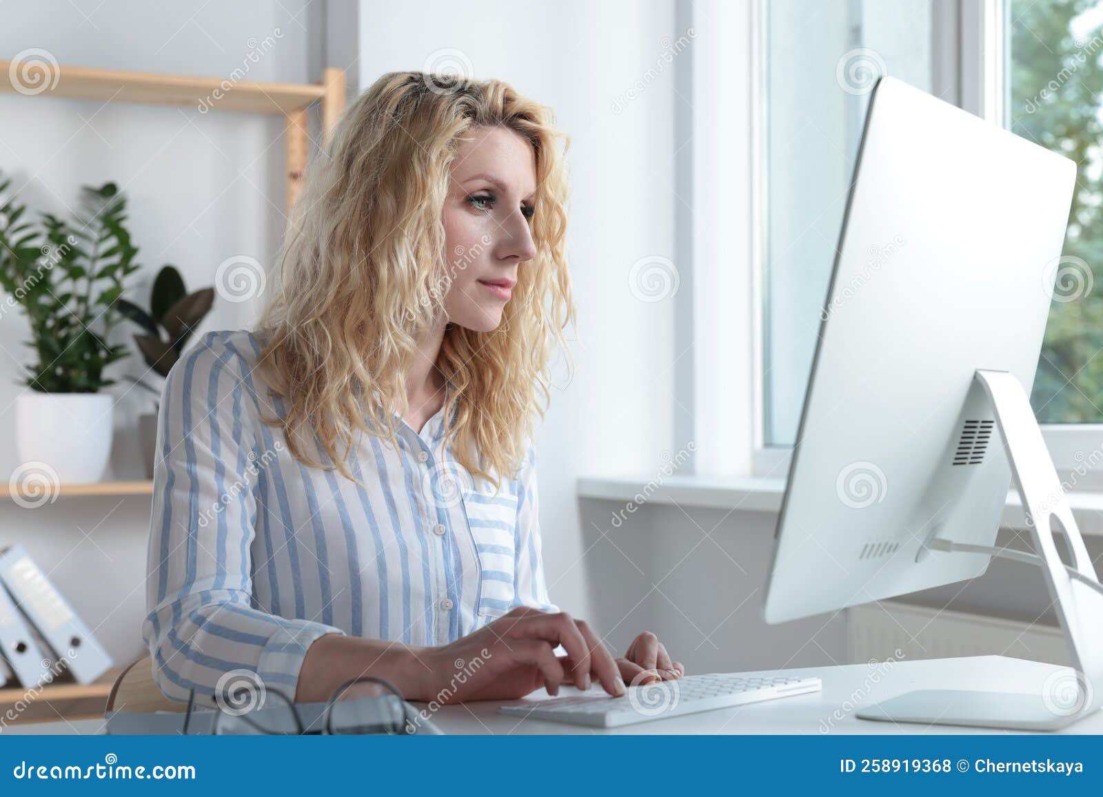 Beautiful Young Woman Working with Computer at Desk in Office Stock ...