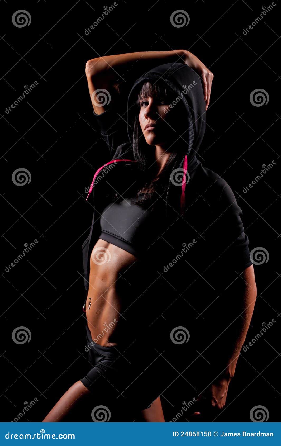Beautiful Young Woman Working Out In The Shadows Stock Photo - Image of ...